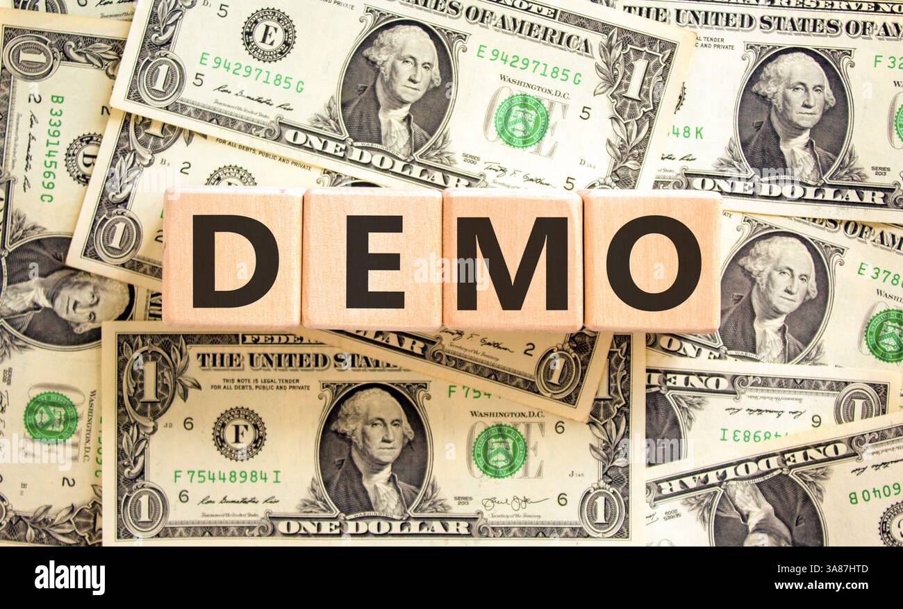 Demo symbol. Concept word Demo on beautiful wooden blocks. Dollar bills ...