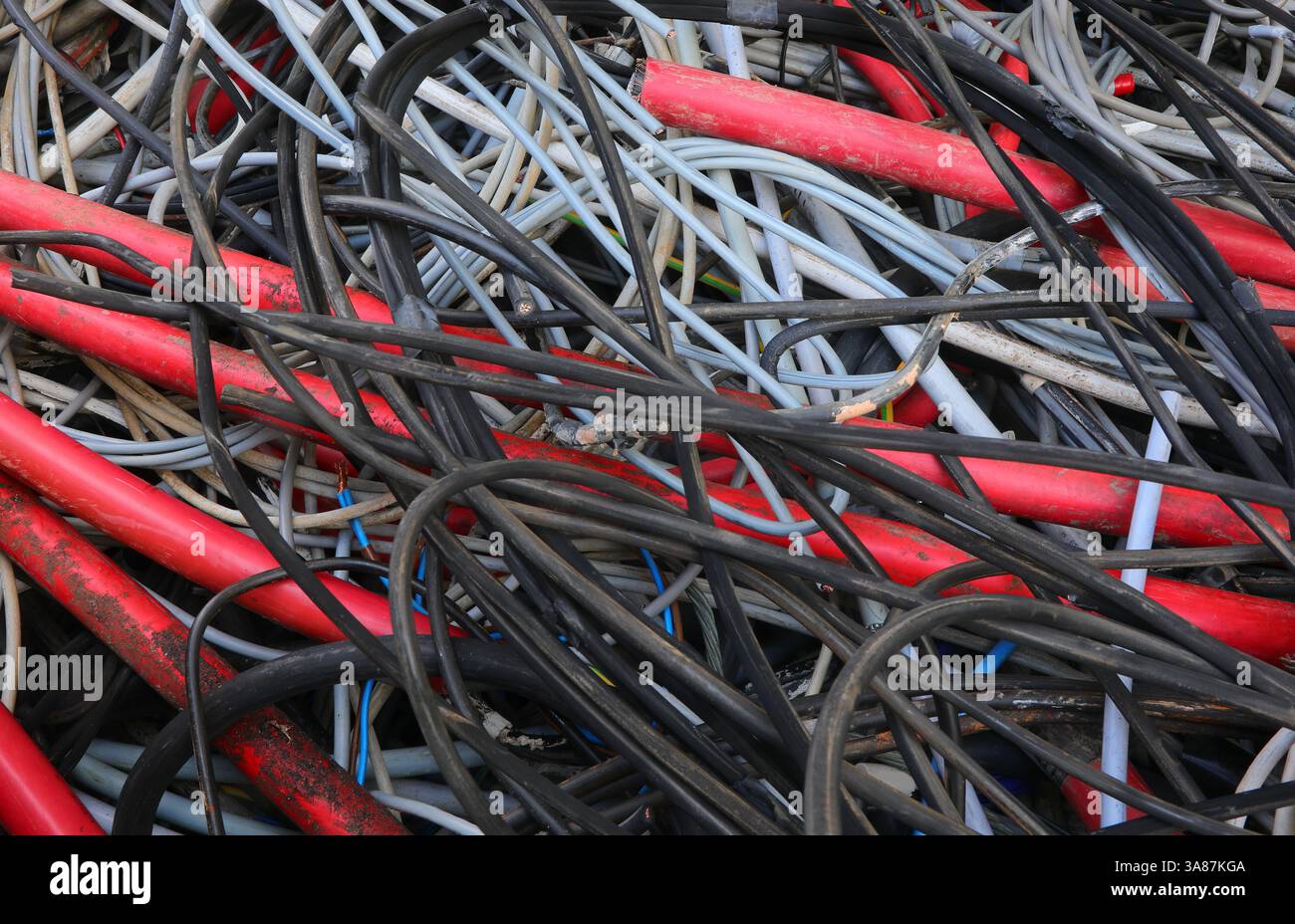 background of old copper electric cables used and collected in the ...