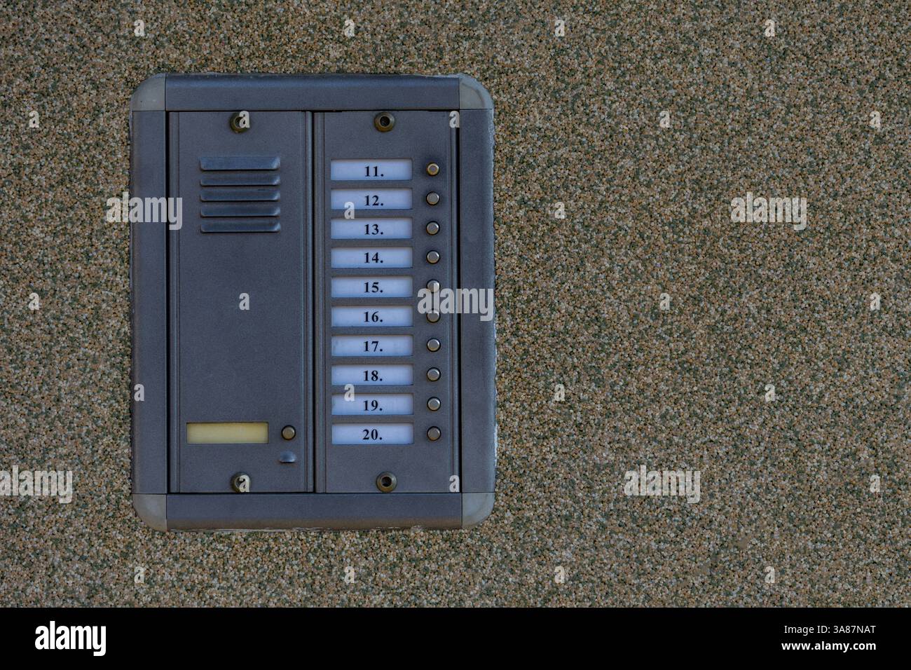 Combination lock control panel, intercom with microphone on the wall at ...