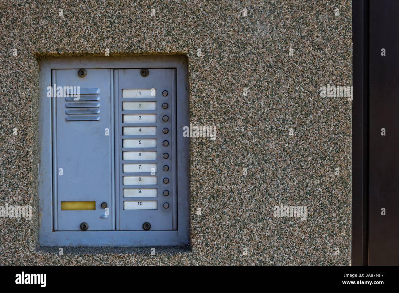 Combination lock control panel, intercom with microphone on the wall at ...