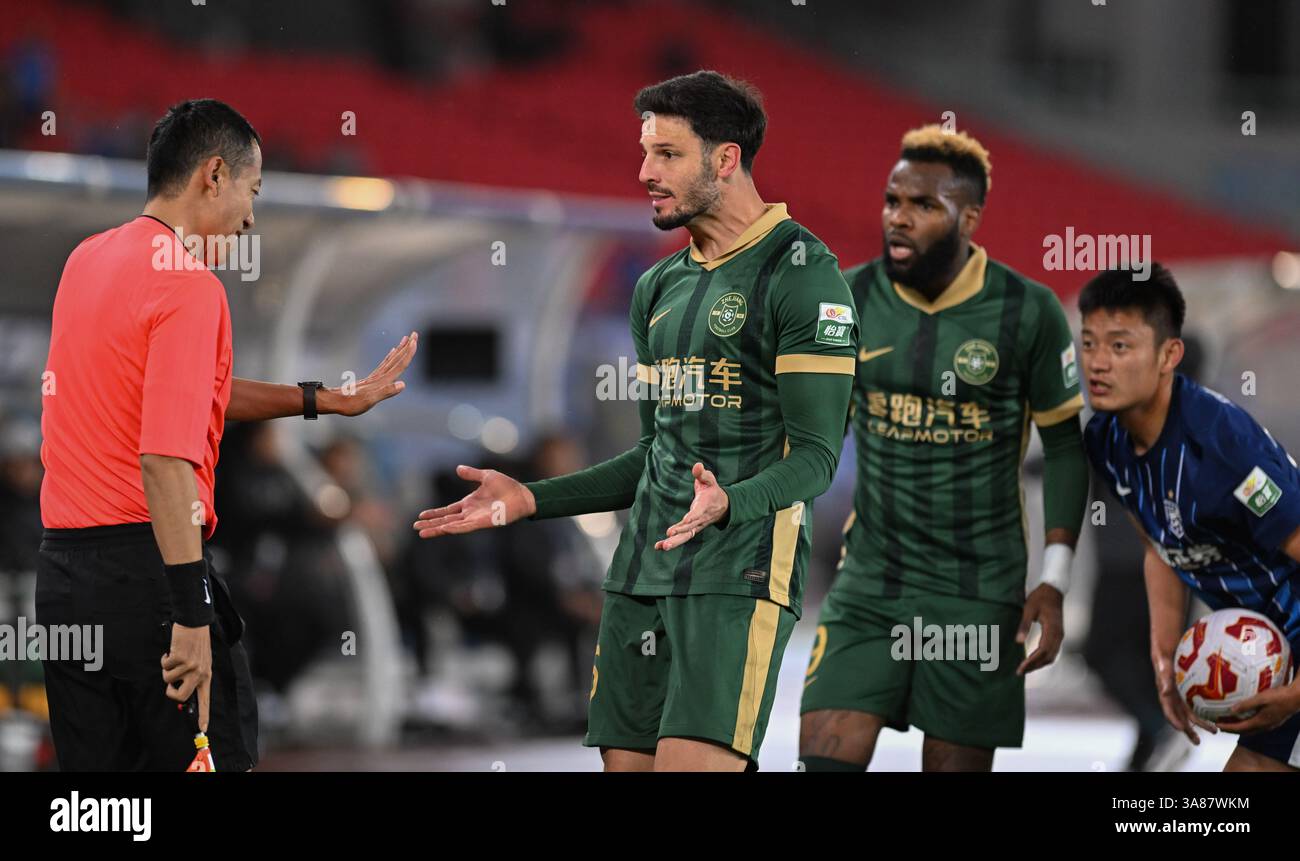 Wuhan, China's Hubei Province. 28th Mar, 2025. Lucas Possignolo (2nd L ...