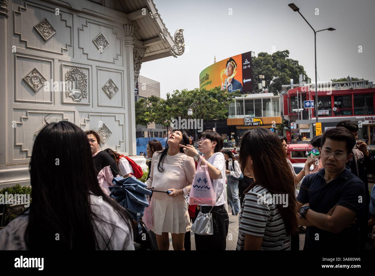 Chiang Mai, Thailand. 28th Mar, 2025. People wait outside after evacuating MAYA Shopping mall in ...