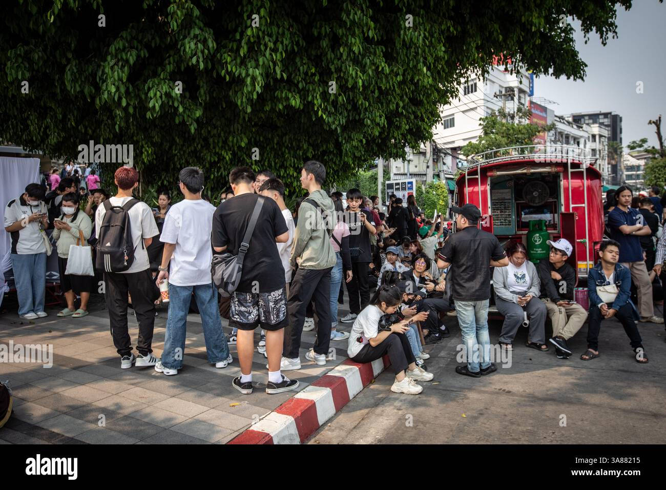 Chiang Mai, Thailand. 28th Mar, 2025. People wait outside after evacuating MAYA Shopping mall in ...