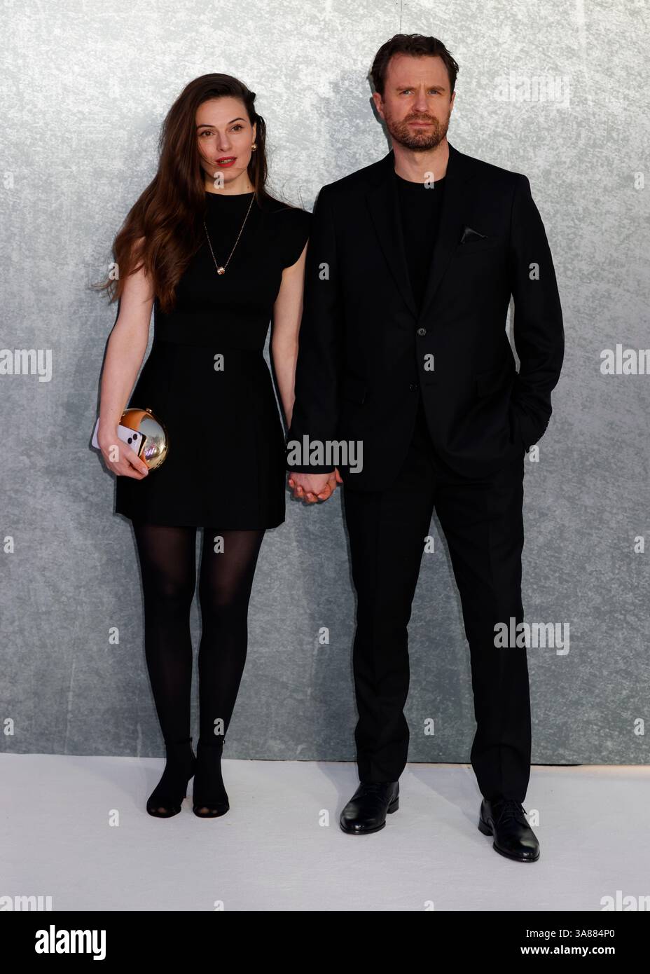 London, UK. 27th Mar, 2025. Andrea Deck and Luke Mably attend the ...