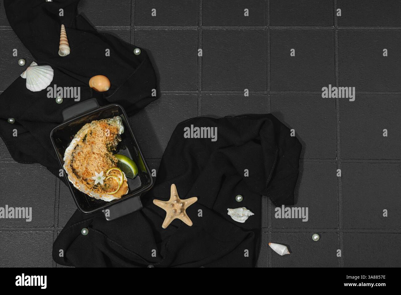 Gourmet baked oyster with herbs and cheese. Elegant seafood dish ...