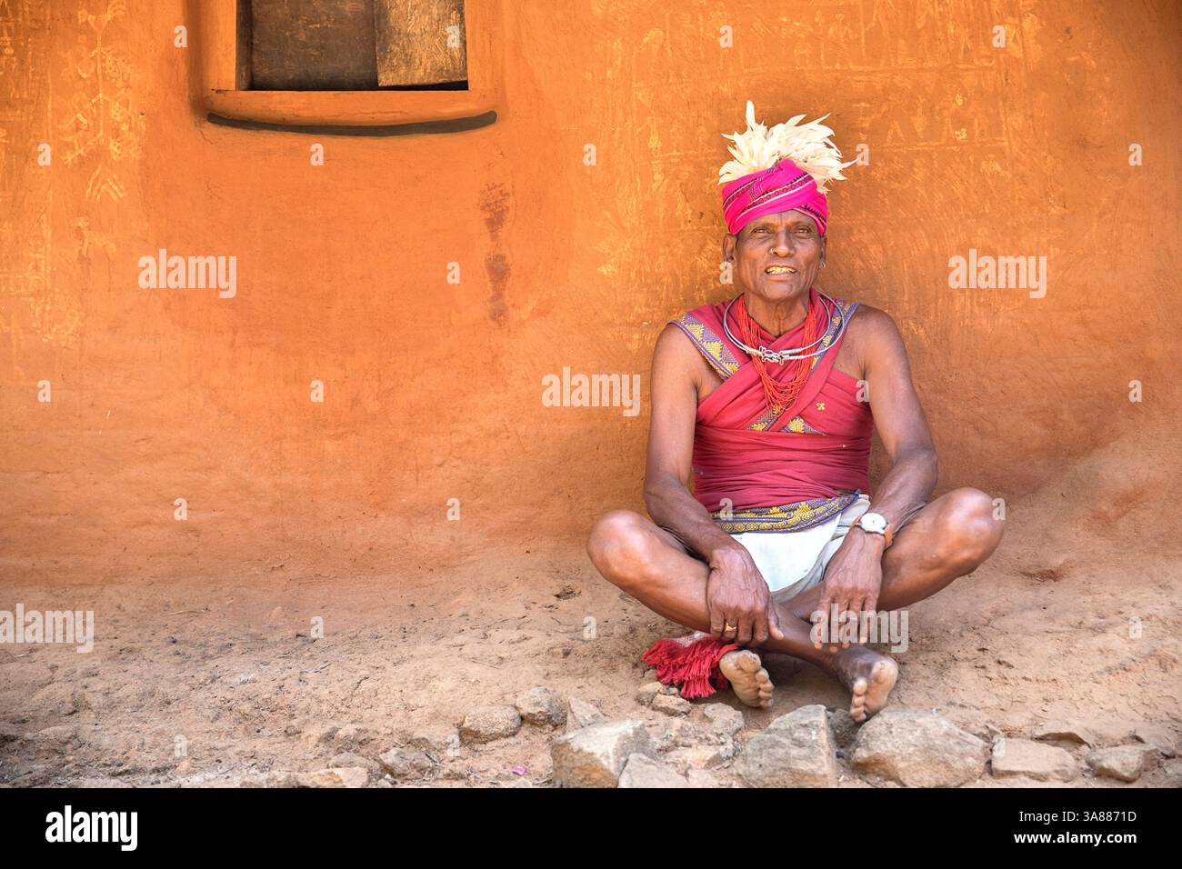 Man from a remote Lanjia Saura tribe in traditional colourful costume ...