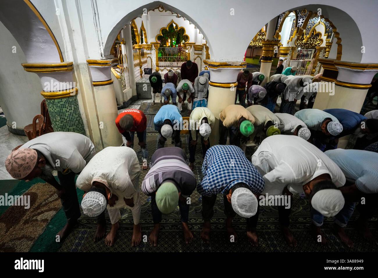 Muslims pray on the last Friday of the holy fasting month of Ramadan at ...