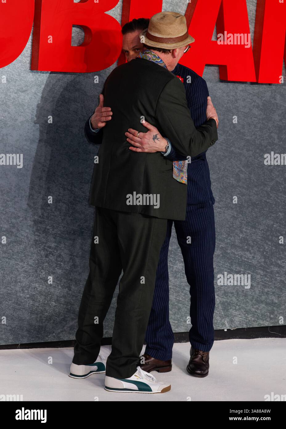 London, UK. 27th Mar, 2025. Geoff Bell and Tom Hardy attend the MobLand ...