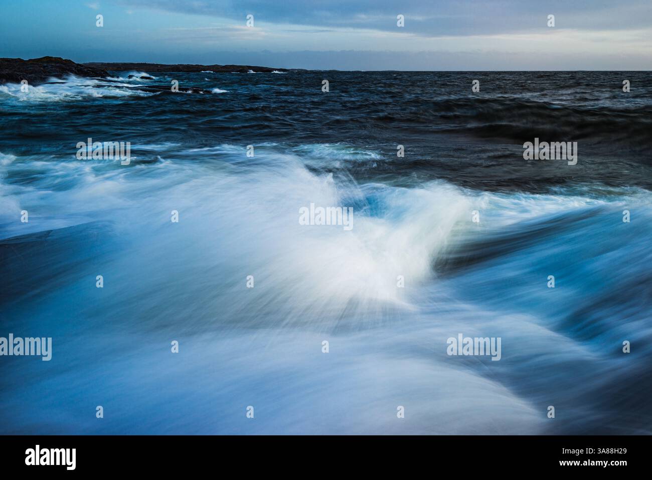 Dramatic waves crash along shoreline hi-res stock photography and ...