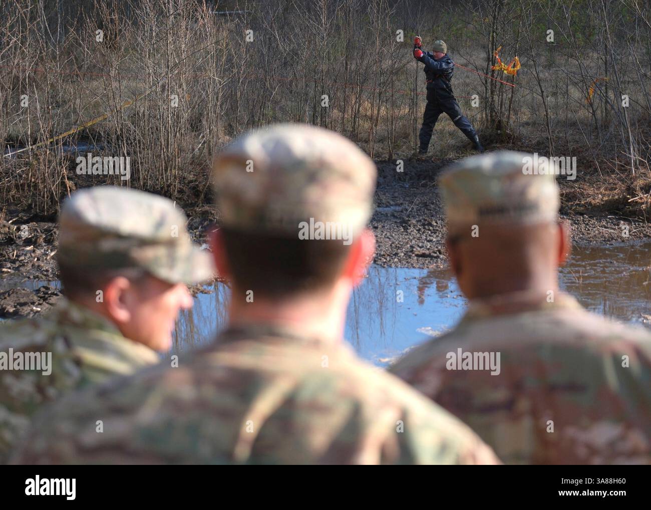 In this image provided by the U.S. Army, a Lithuanian engineer probes ...