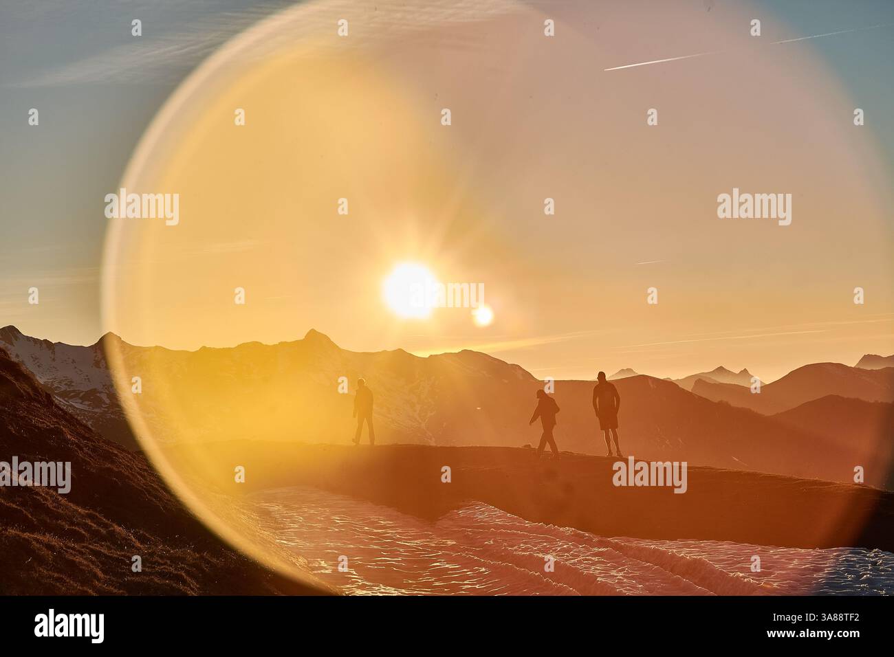 Mountaineers silhouetted against the sunset in the Picos de Europa ...