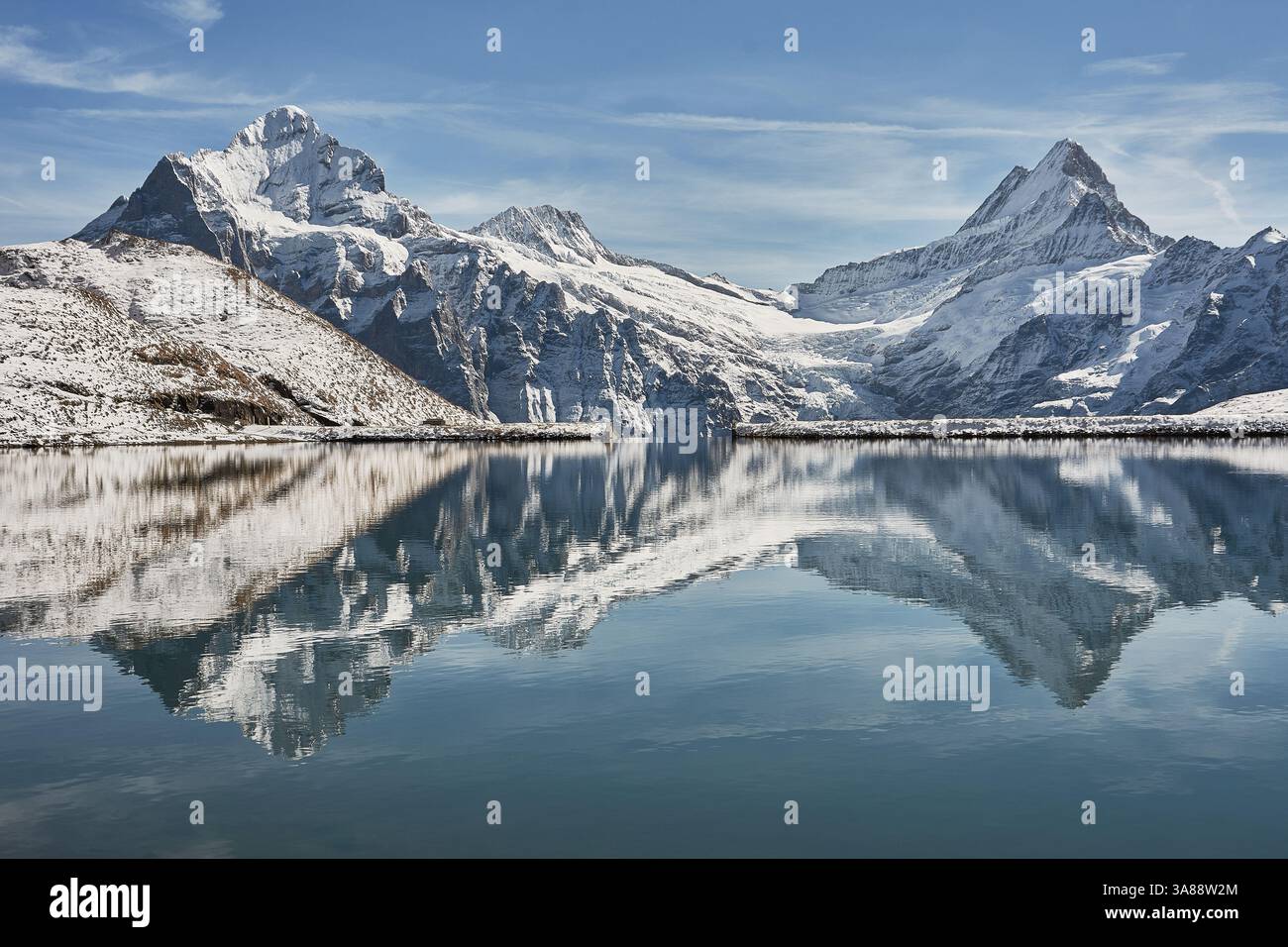 The iconic Eiger mountain reflected in the crystal-clear waters of ...
