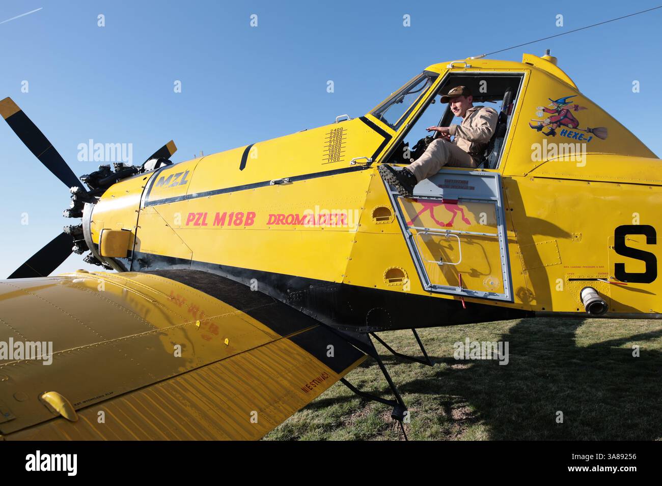 Ballenstedt, Germany. 28th Mar, 2025. Pilot Marcin Berlik climbs out of ...