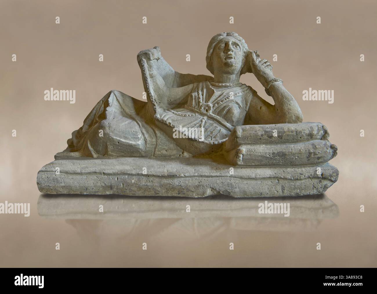 Reclining women on the lid of an Etruscan funerary cinerary urn ...