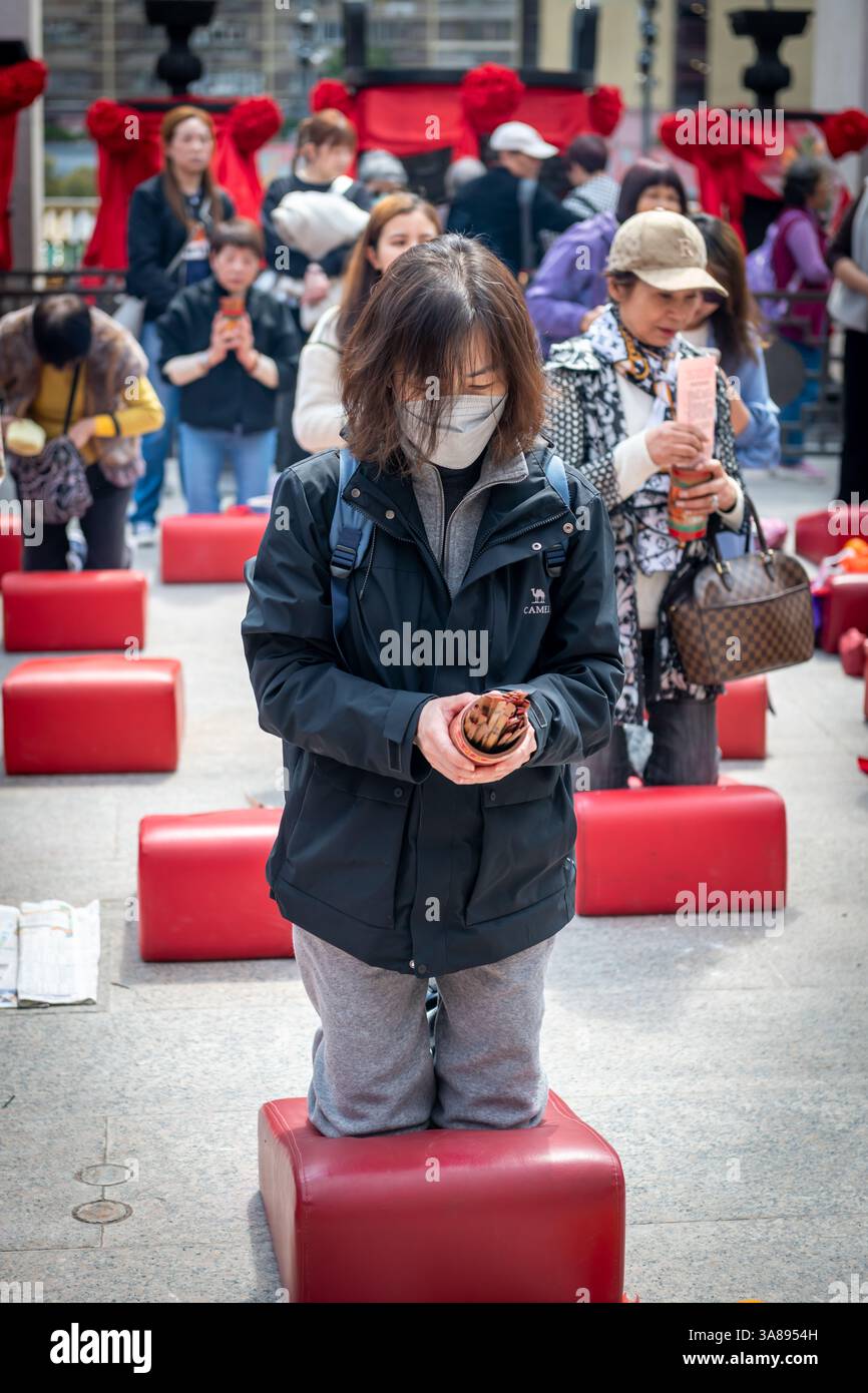 Hong Kong. China- 02.24.2025. Pilgrims in Sik Sik Yuen Wong Tai Sin ...