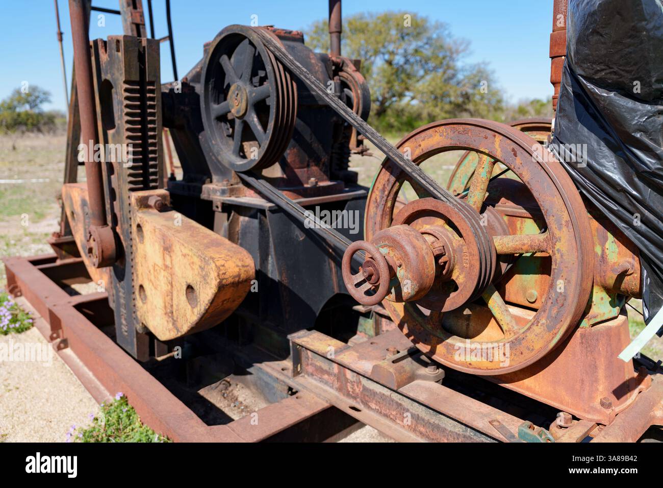Idle, rusty oil well pumping equipment abandoned in field in West Texas ...