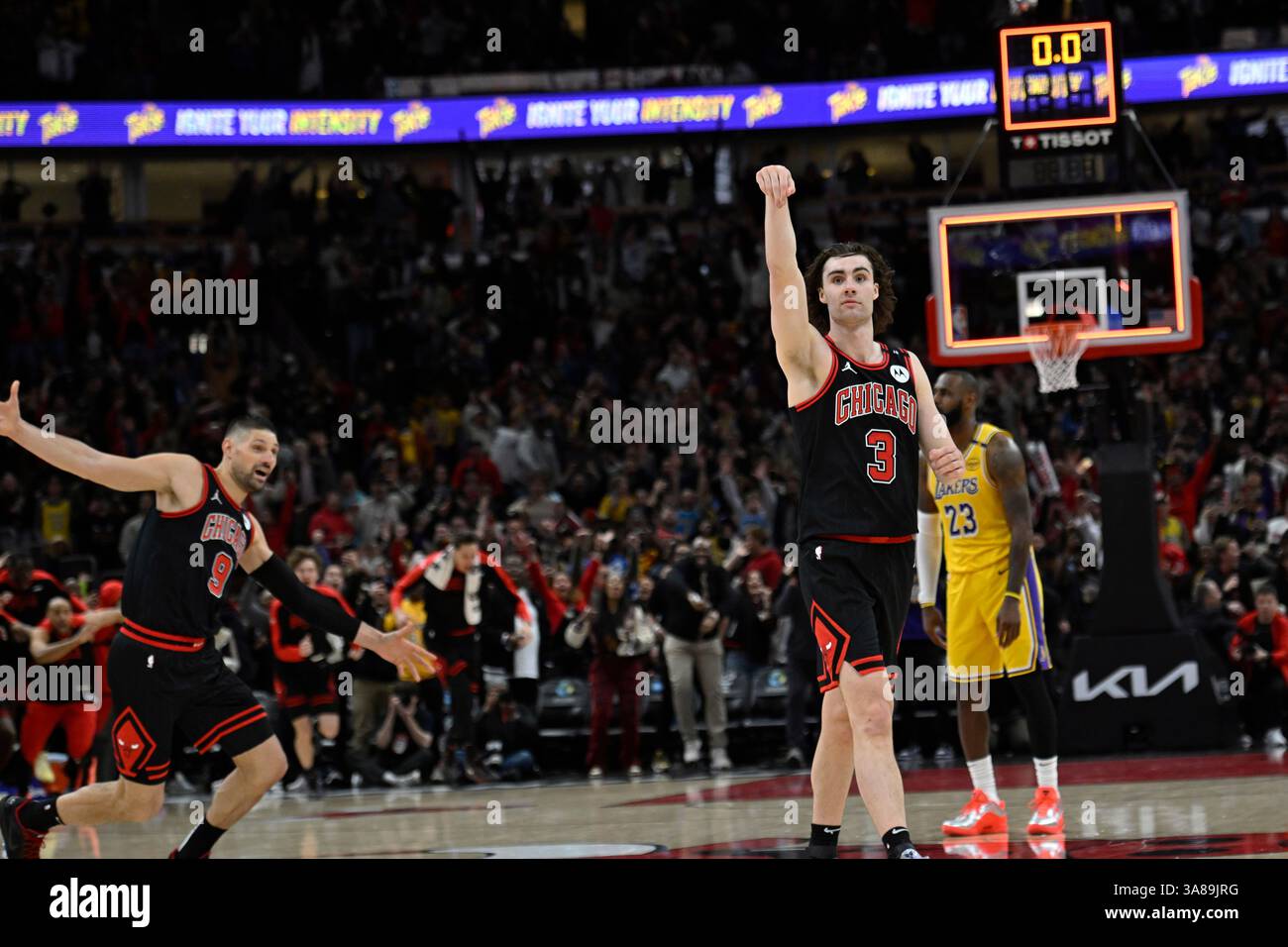 Chicago Bulls' Josh Giddey follows through while watching his game ...
