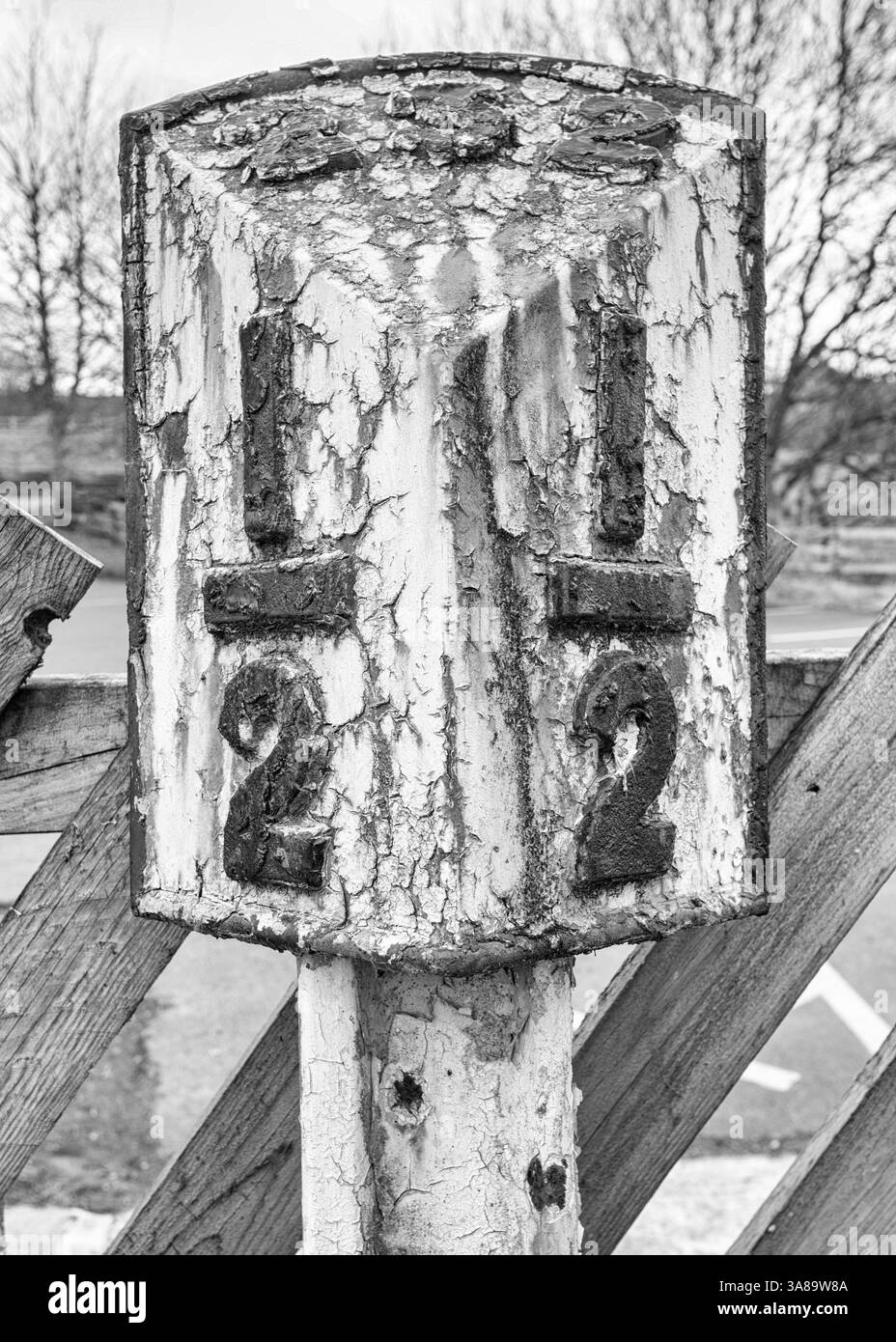 Cast iron, two-faced, angled, half mile railway distance marker seen on ...