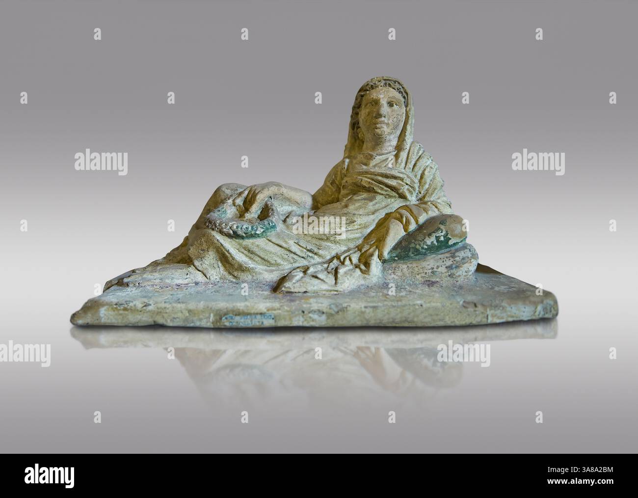 Reclining women on the lid of an Etruscan funerary cinerary urn ...