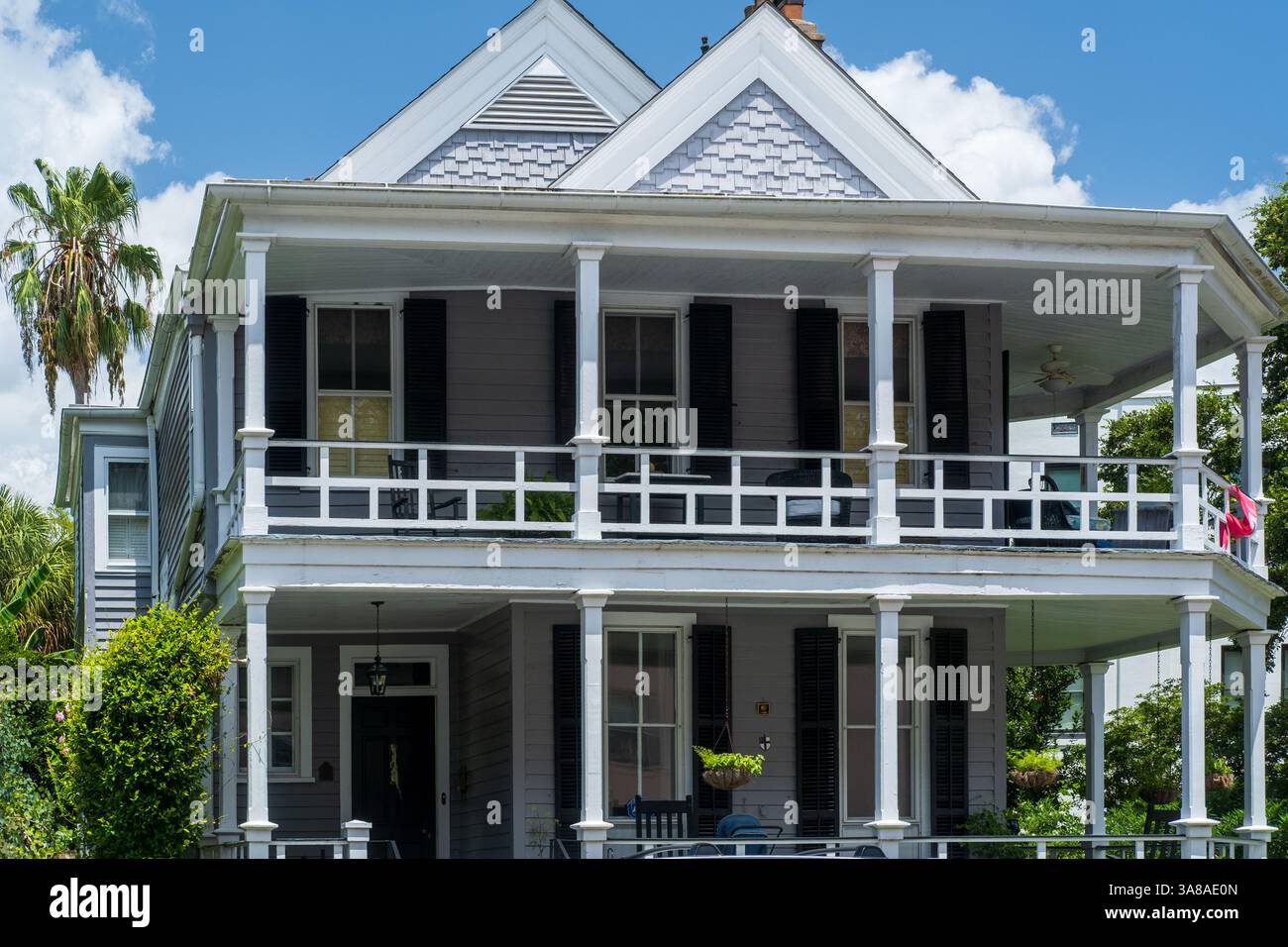 View of a mansion with veranda and balcony on a street in Charleston in ...