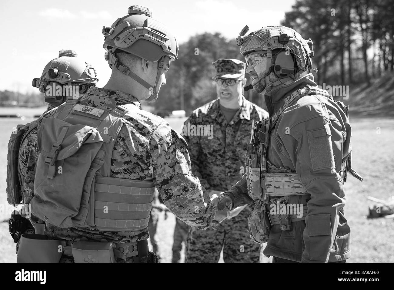 Vice President JD Vance, right, shakes hands with U.S. Marine Corps Sgt ...