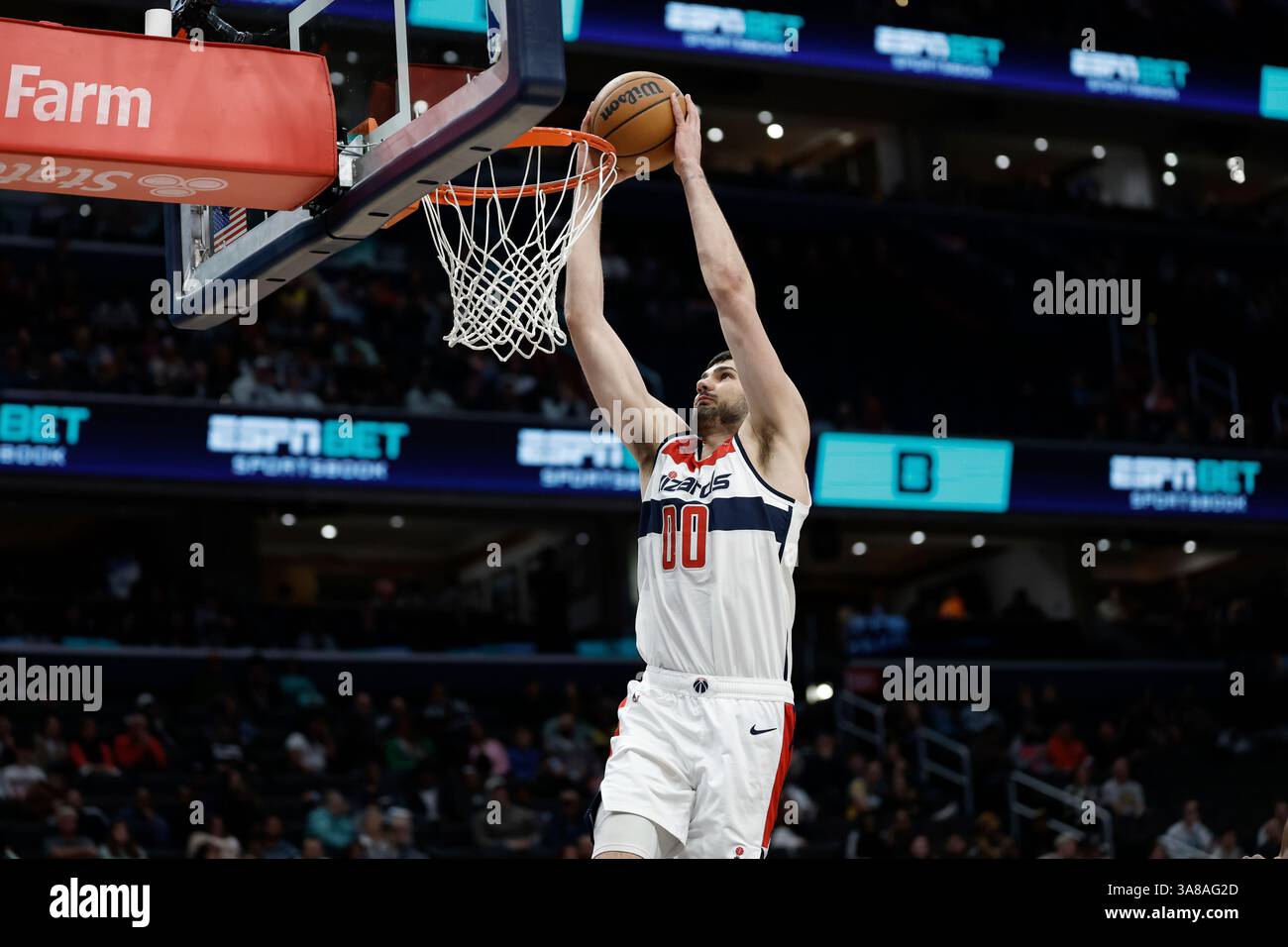 Washington Wizards forward Tristan Vukcevic (00) dunks the ball during ...