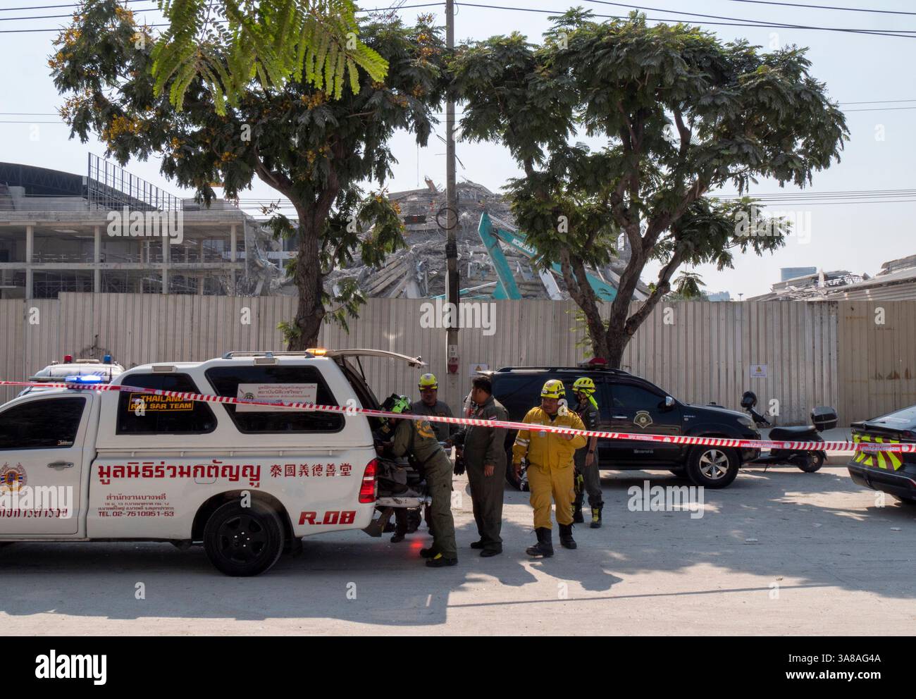 Rescue workers arrive on scene at a construction building collapse in the Chatuchak area ...