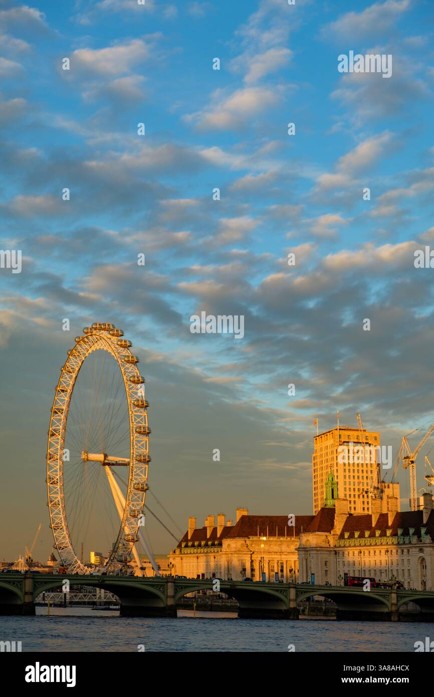 The London Eye and Westminster Bridge glow in the golden hour light ...