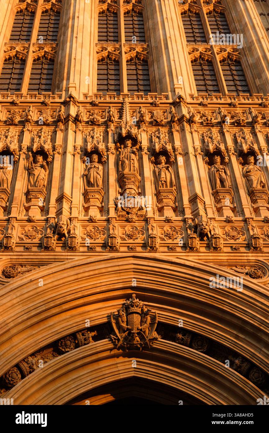 The ornate facade of the Palace of Westminster, featuring statues of ...