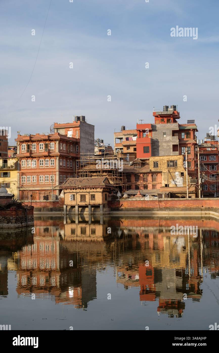 A mix of traditional and modern buildings in Nepal, one under ...