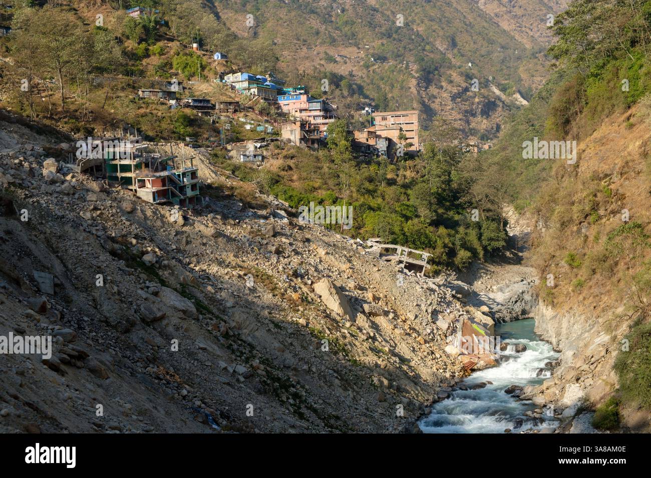 Homes in a mountainside village destroyed by a landslide, leaving ...