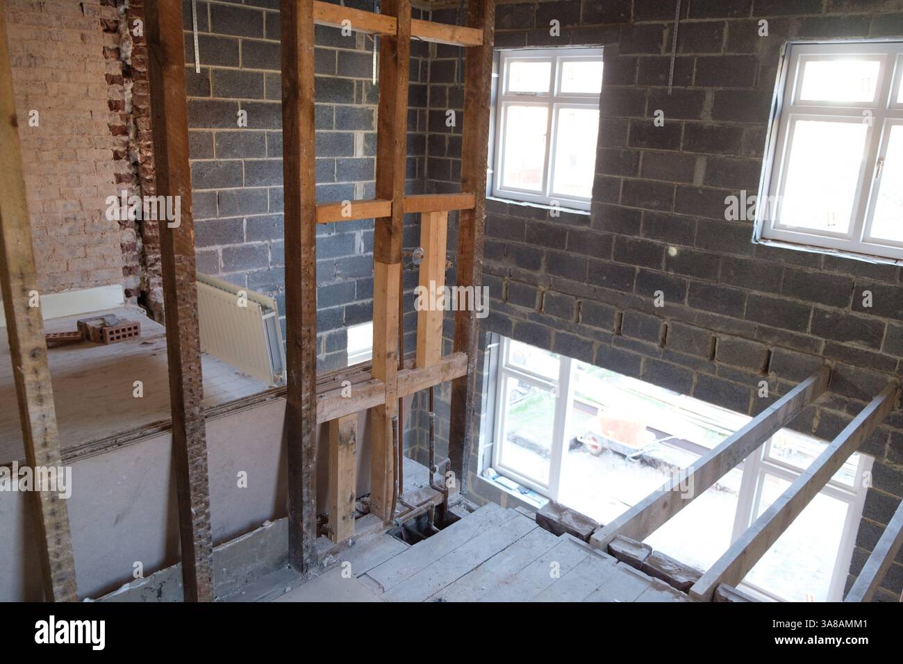 Interior view of a building under construction, showing exposed timber ...