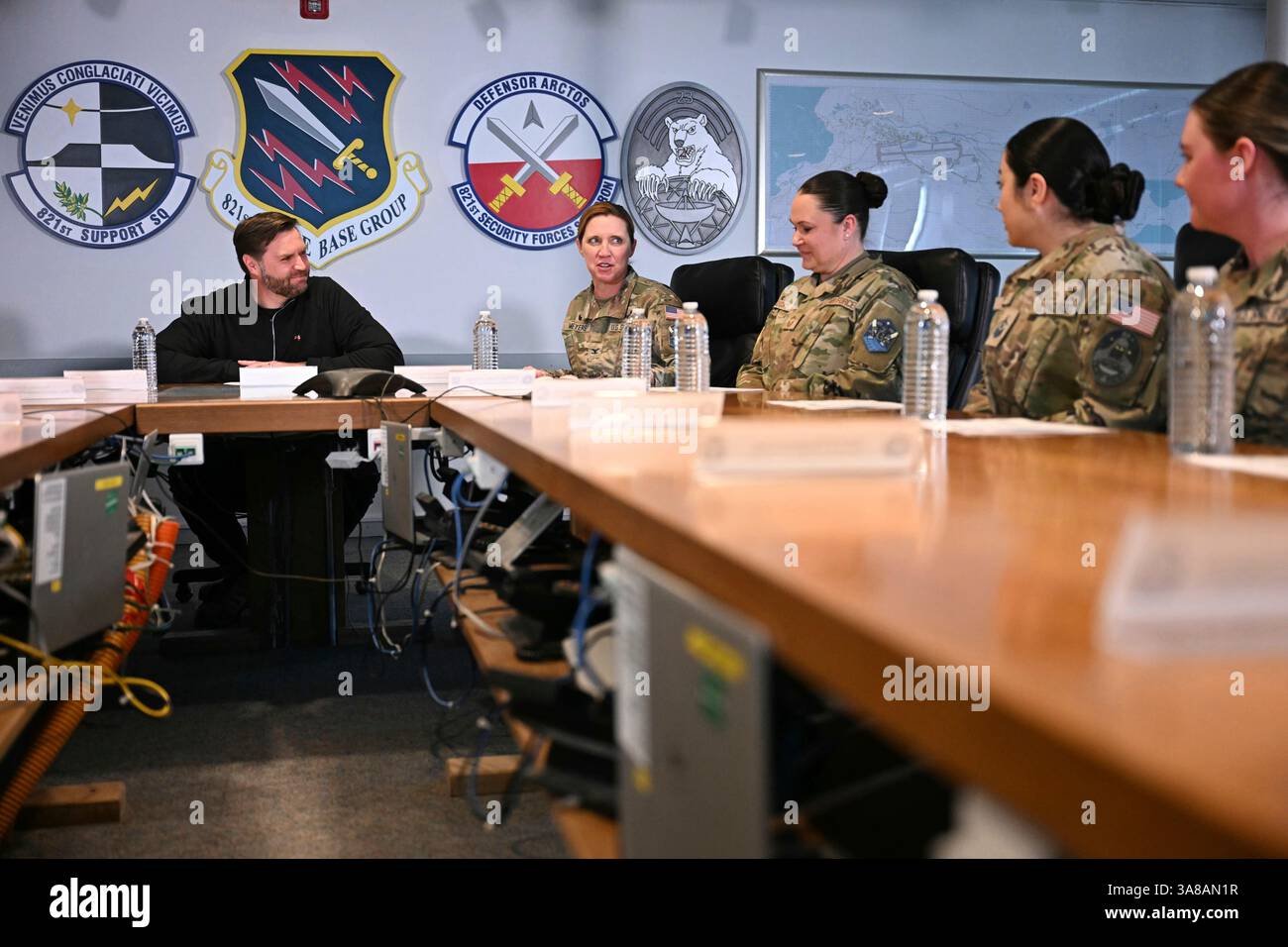 Vice President JD Vance, left, listens during a briefing at Pituffik ...