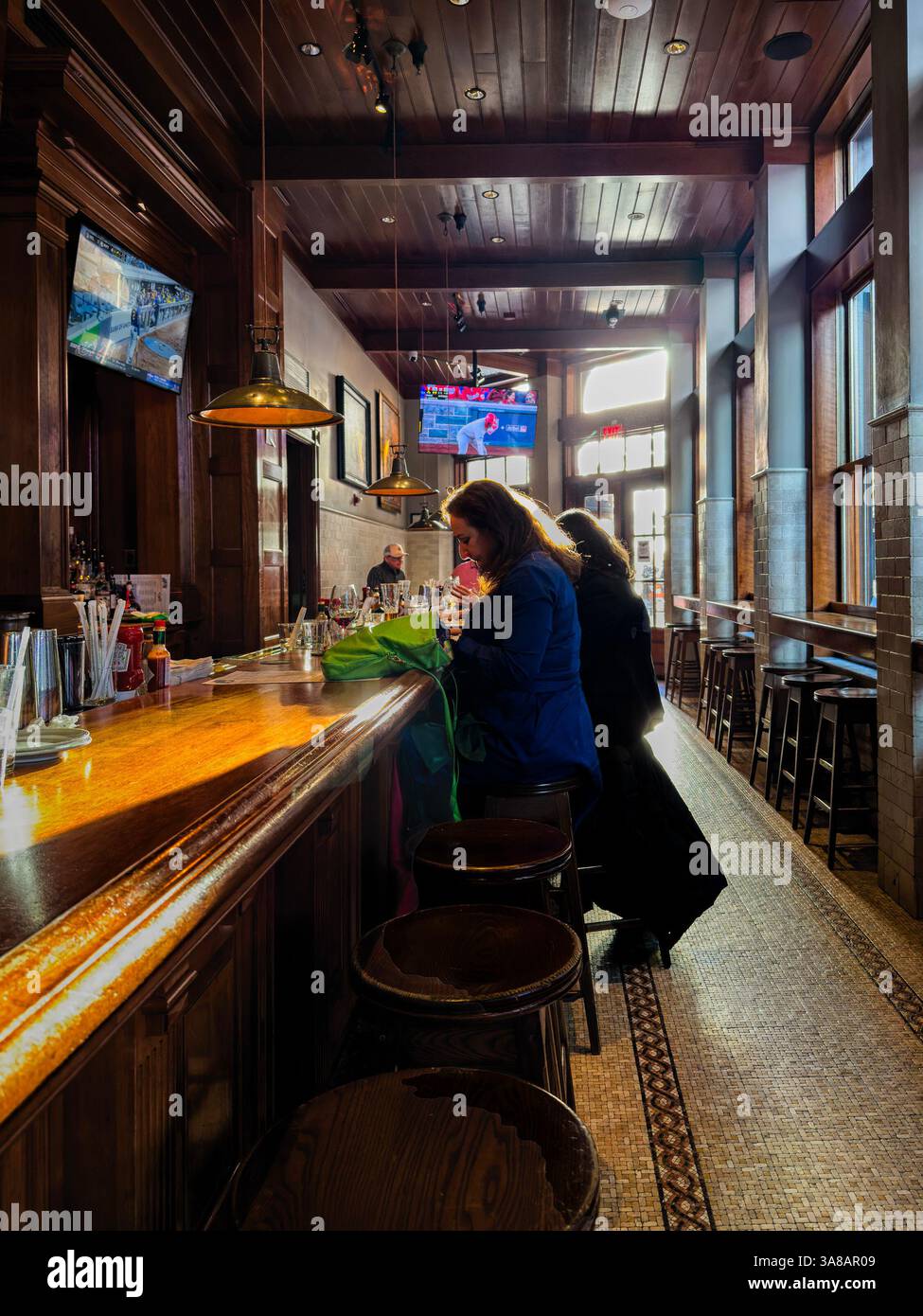 Long shadows on the bar in the late afternoon Stock Photo - Alamy