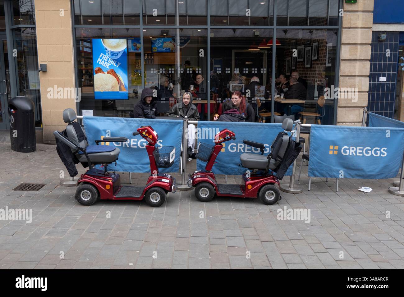 Two Rascal mobility scooters parked at Greggs food and drink outlet ...