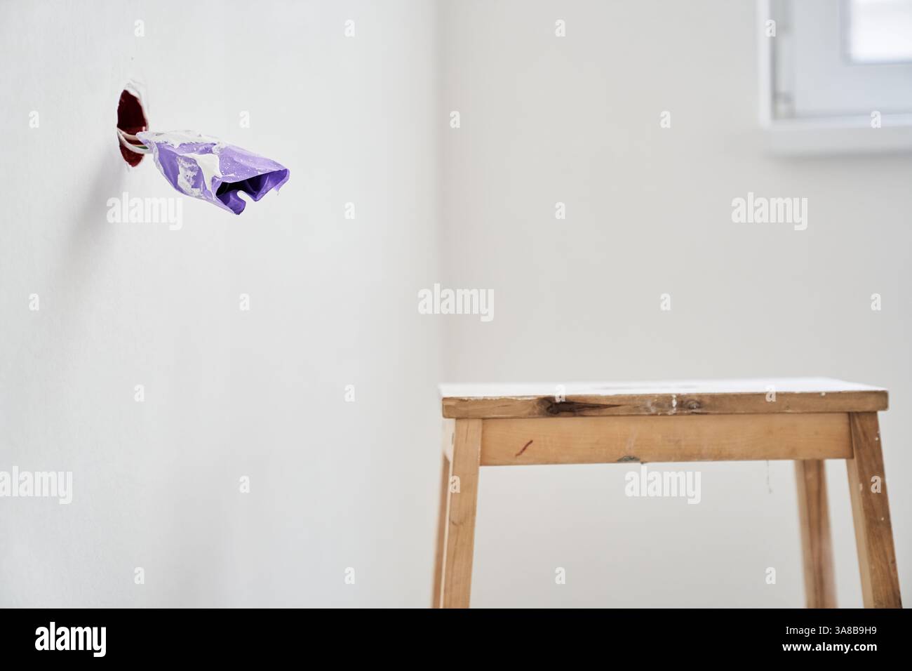 The electrical outlet is unfinished, the wires are rewound with purple ...