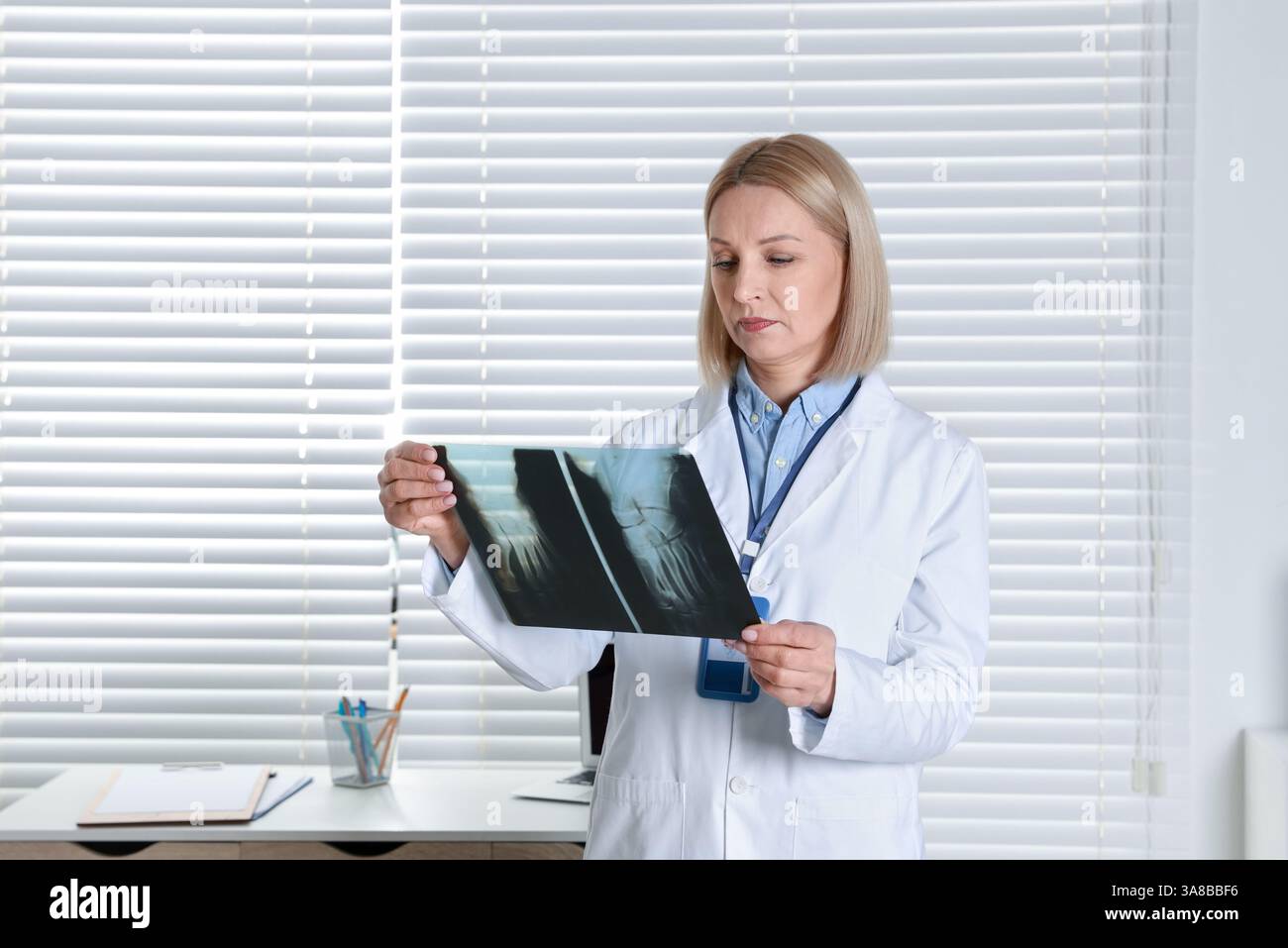Doctor examining foot x-ray near window in clinic Stock Photo - Alamy