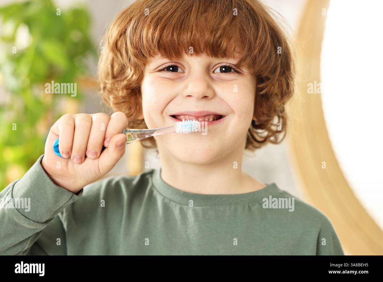 Cute boy brushing his teeth indoors, closeup Stock Photo - Alamy