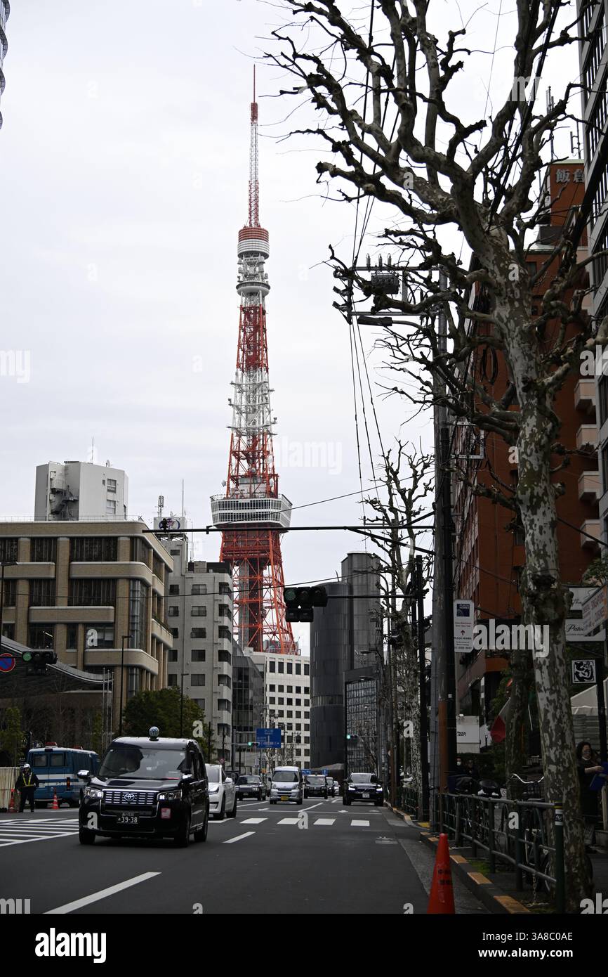 Tokyo Tower viewed from below on an overcast day in Tokyo, Japan – low-angle architectural ...