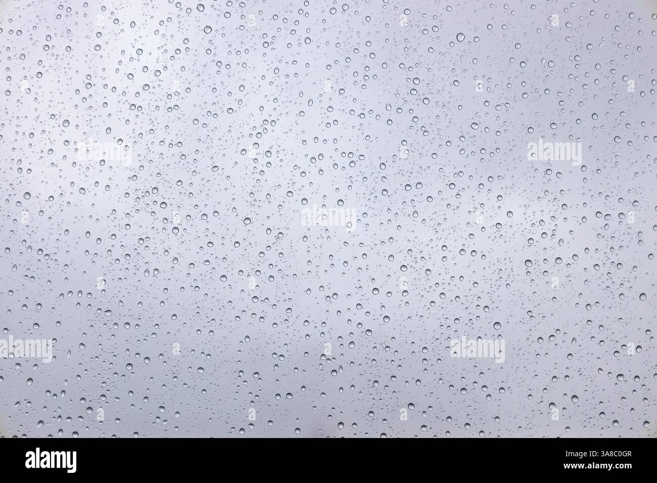 Water Droplets Scattered Across Glass Creating an Abstract Pattern ...