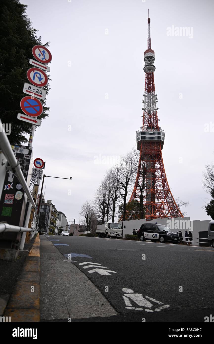 Tokyo Tower viewed from below on an overcast day in Tokyo, Japan – low-angle architectural ...