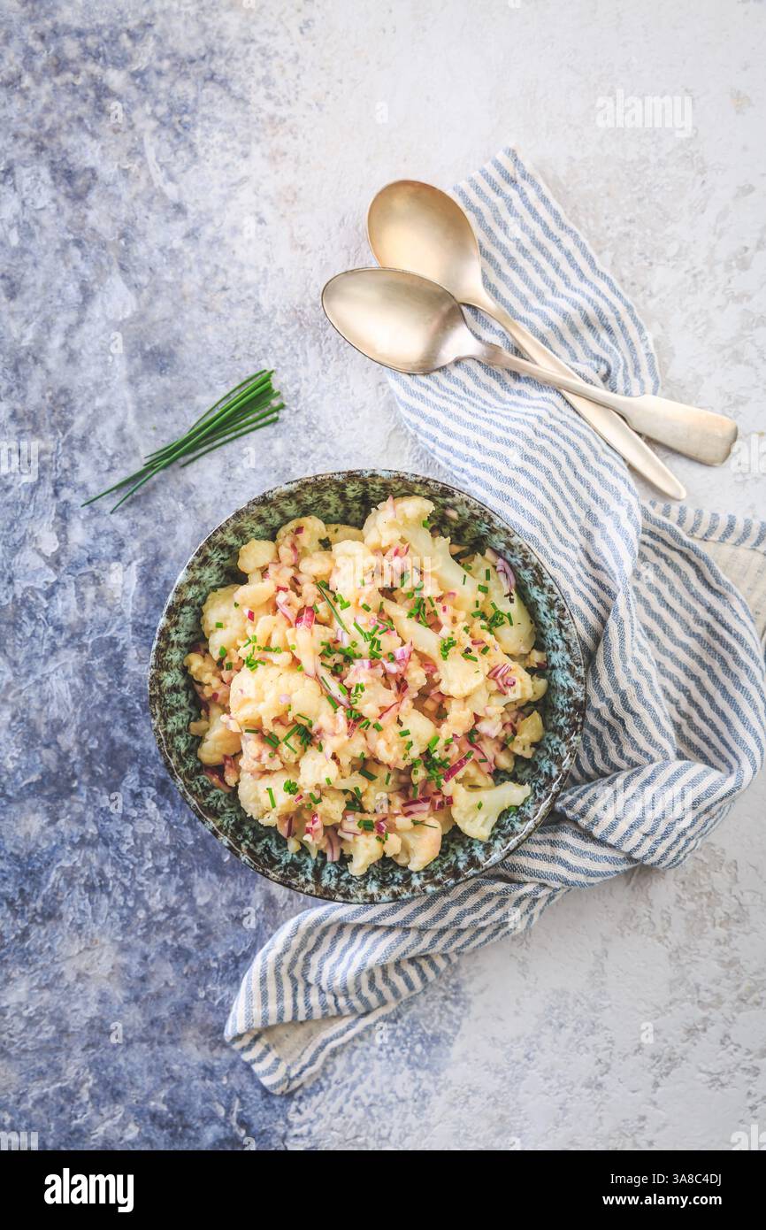 Cold cauliflower salad with red onions and chives Stock Photo - Alamy