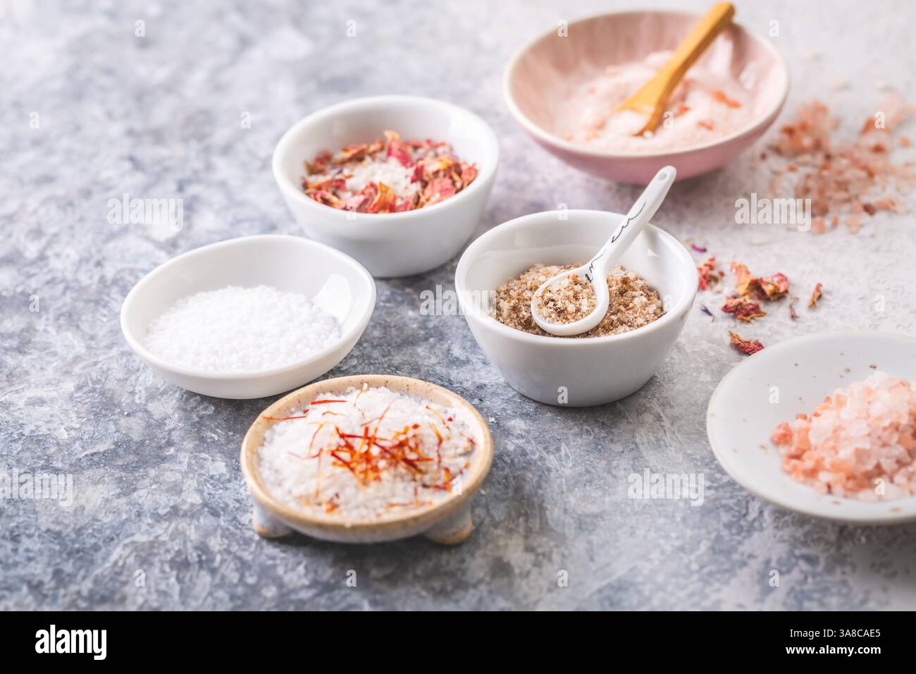 Assortment of different types of salt, sea, himalayan, saffron, with ...