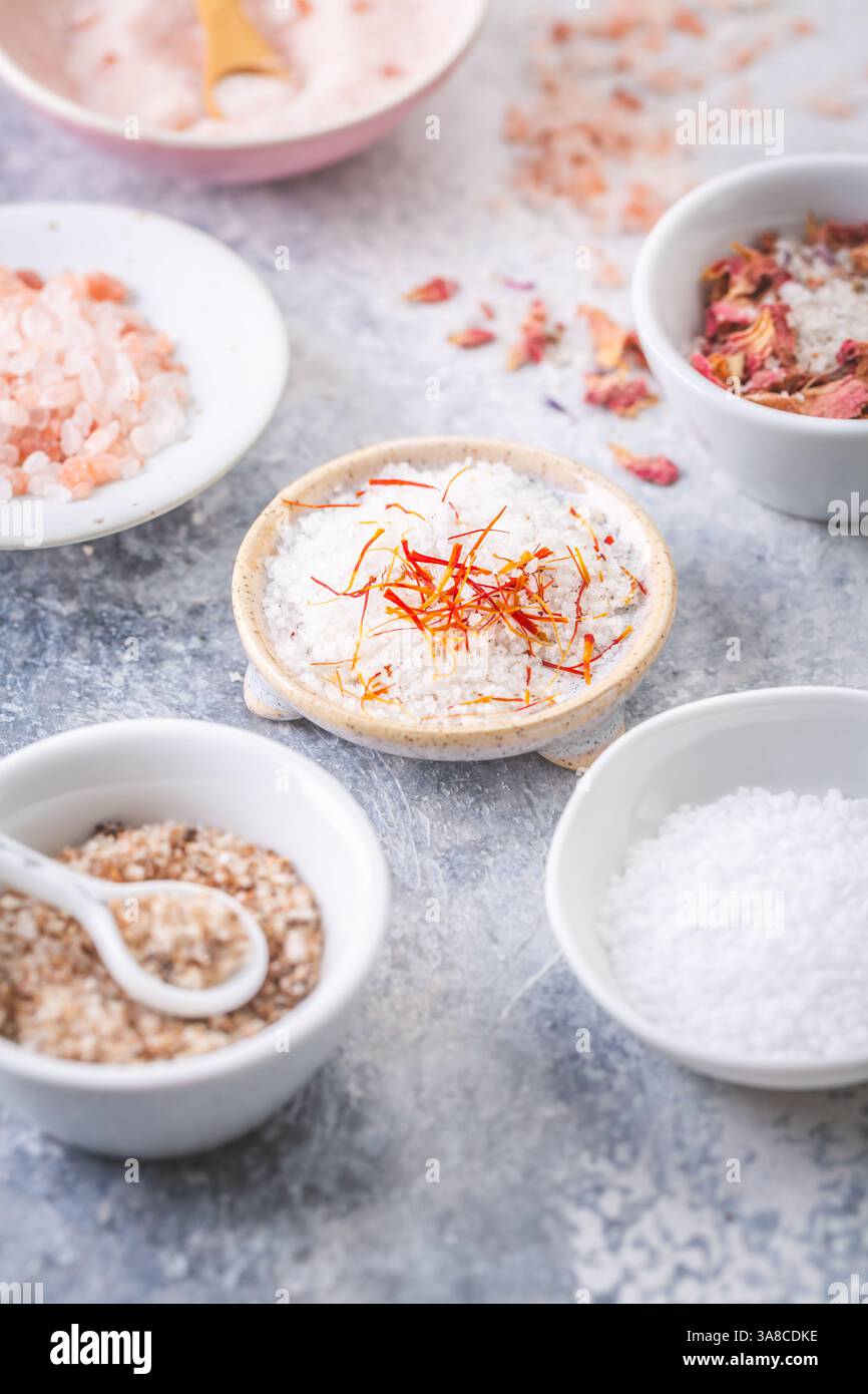 Assortment of different types of salt, sea, himalayan, saffron, with ...