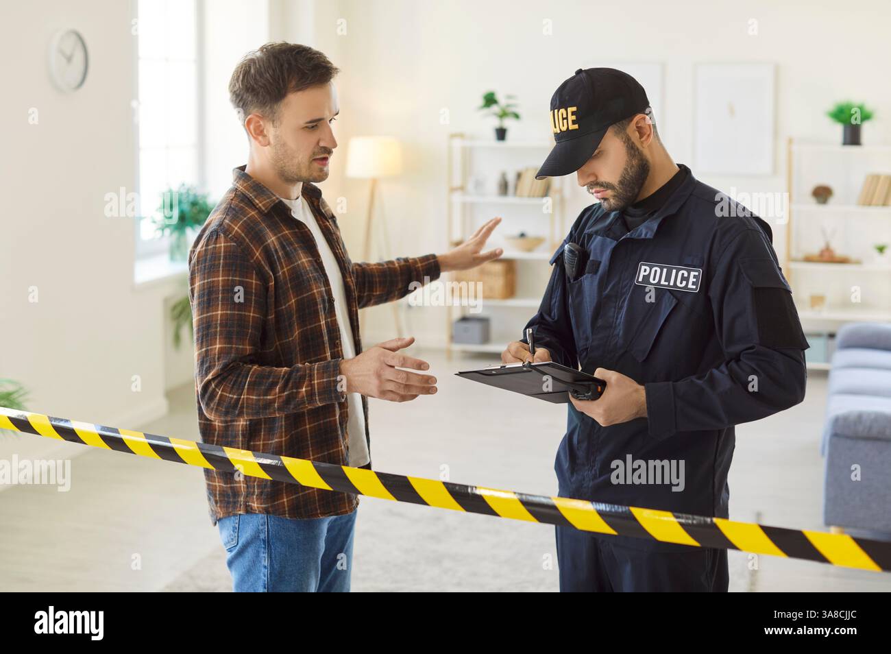 Detective Gathering Evidence With Witness At Crime Scene Stock Photo ...
