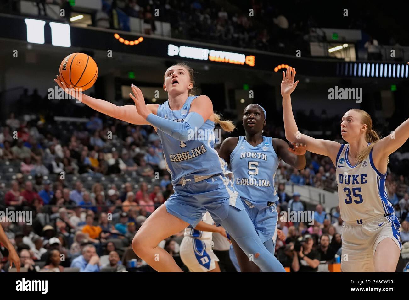 North Carolina guard Alyssa Ustby (1) goes to the basket past Duke ...