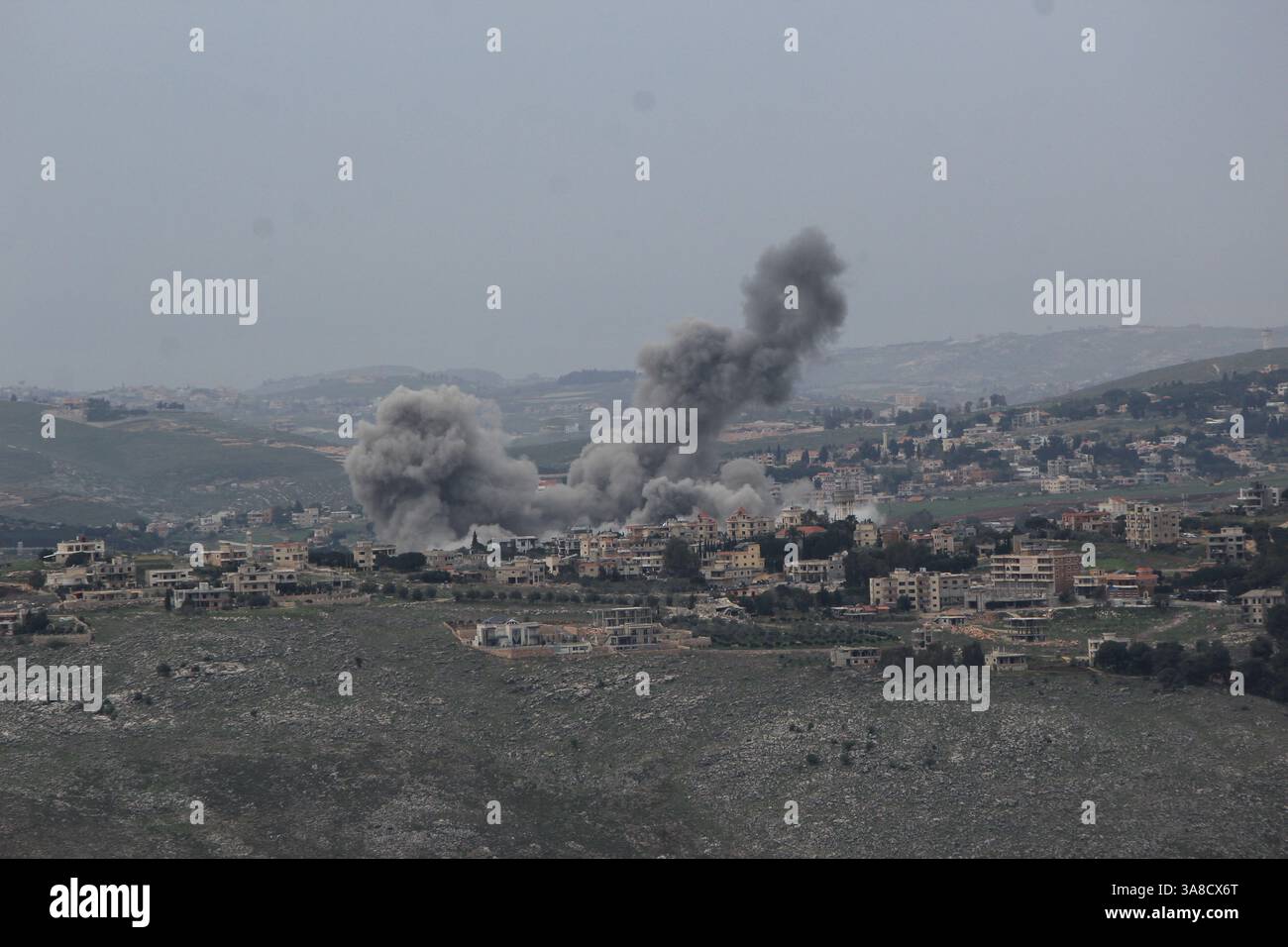 Kfar Tebnit, Lebanon. 28th Mar, 2025. Smoke rises following an Israeli ...