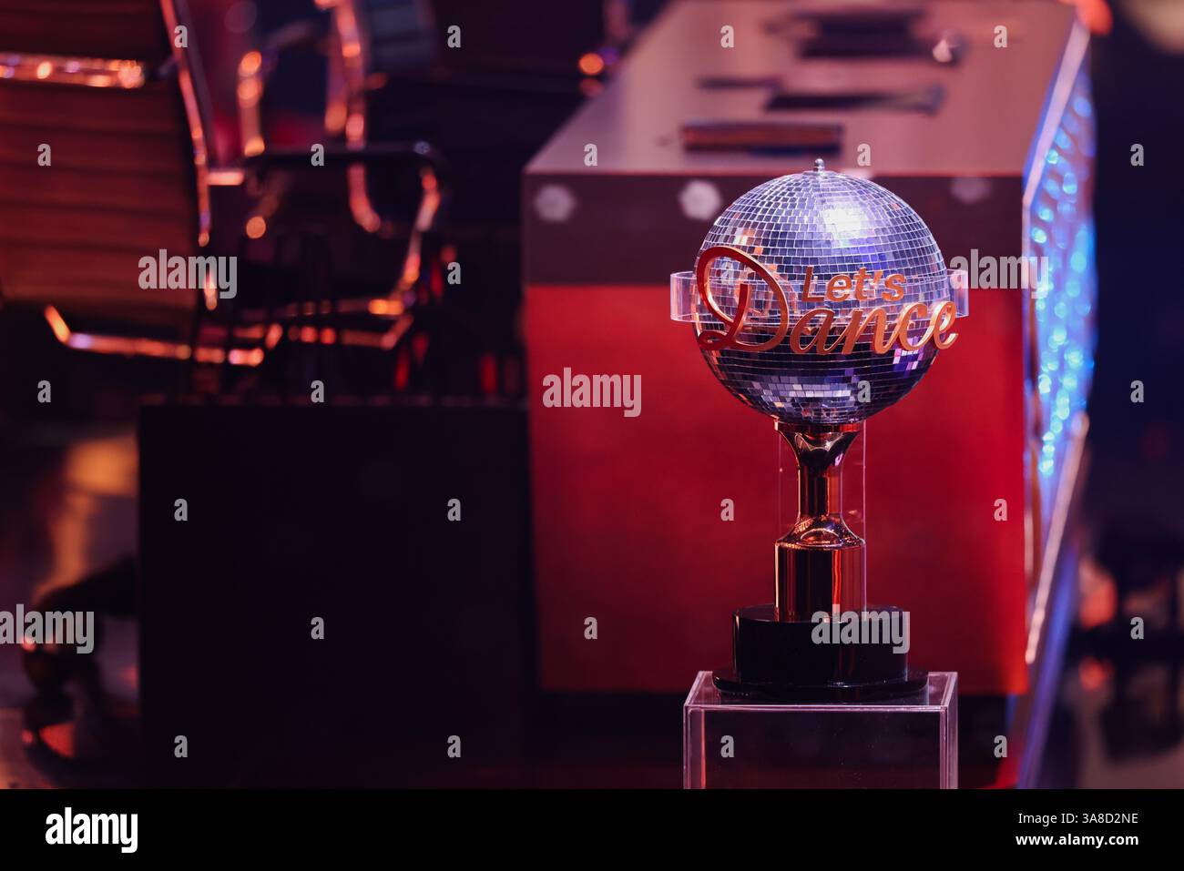 Cologne, Germany. 28th Mar, 2025. The winner's trophy stands next to ...