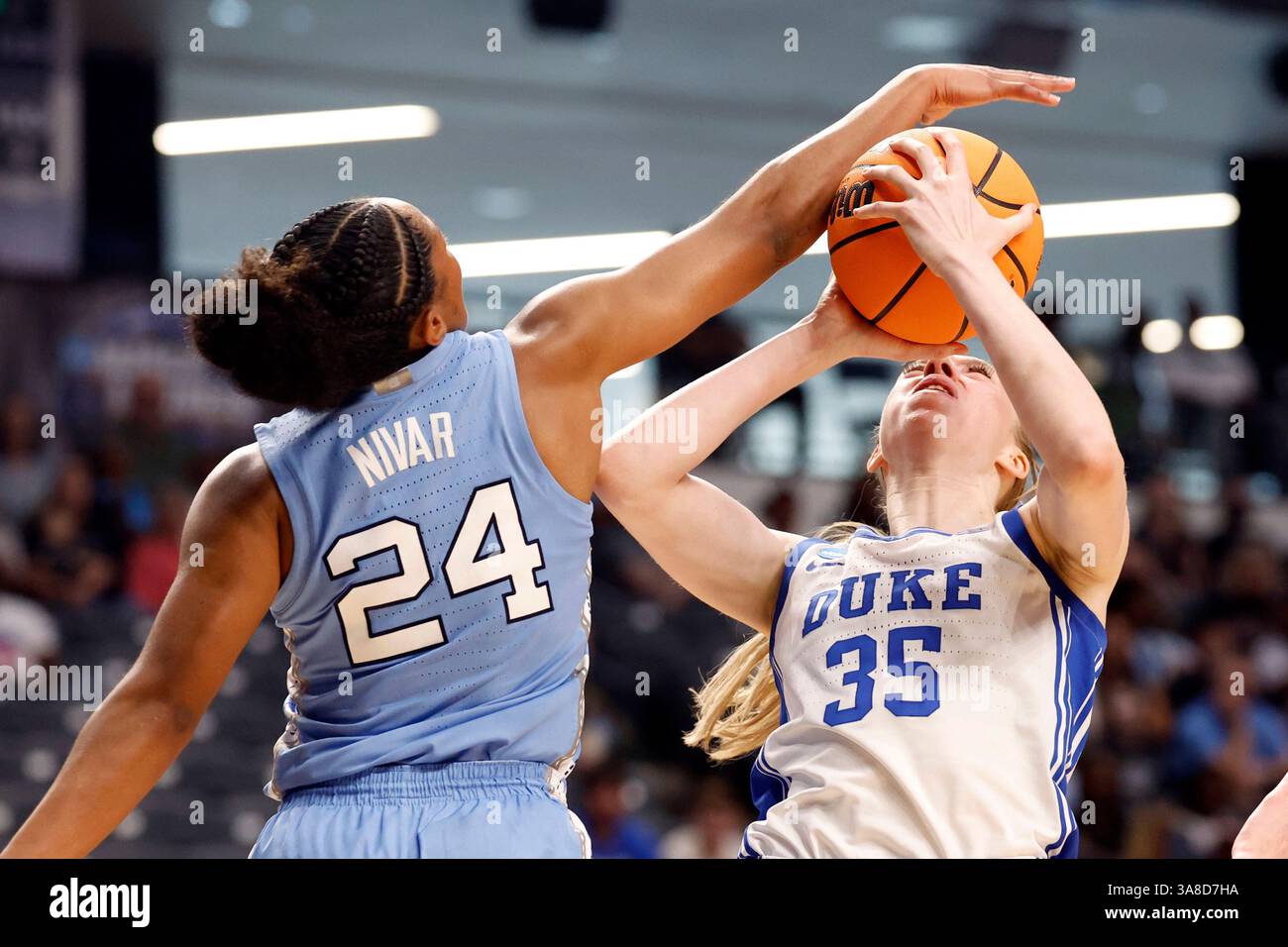 North Carolina guard Indya Nivar (24) blocks the shot by Duke forward ...
