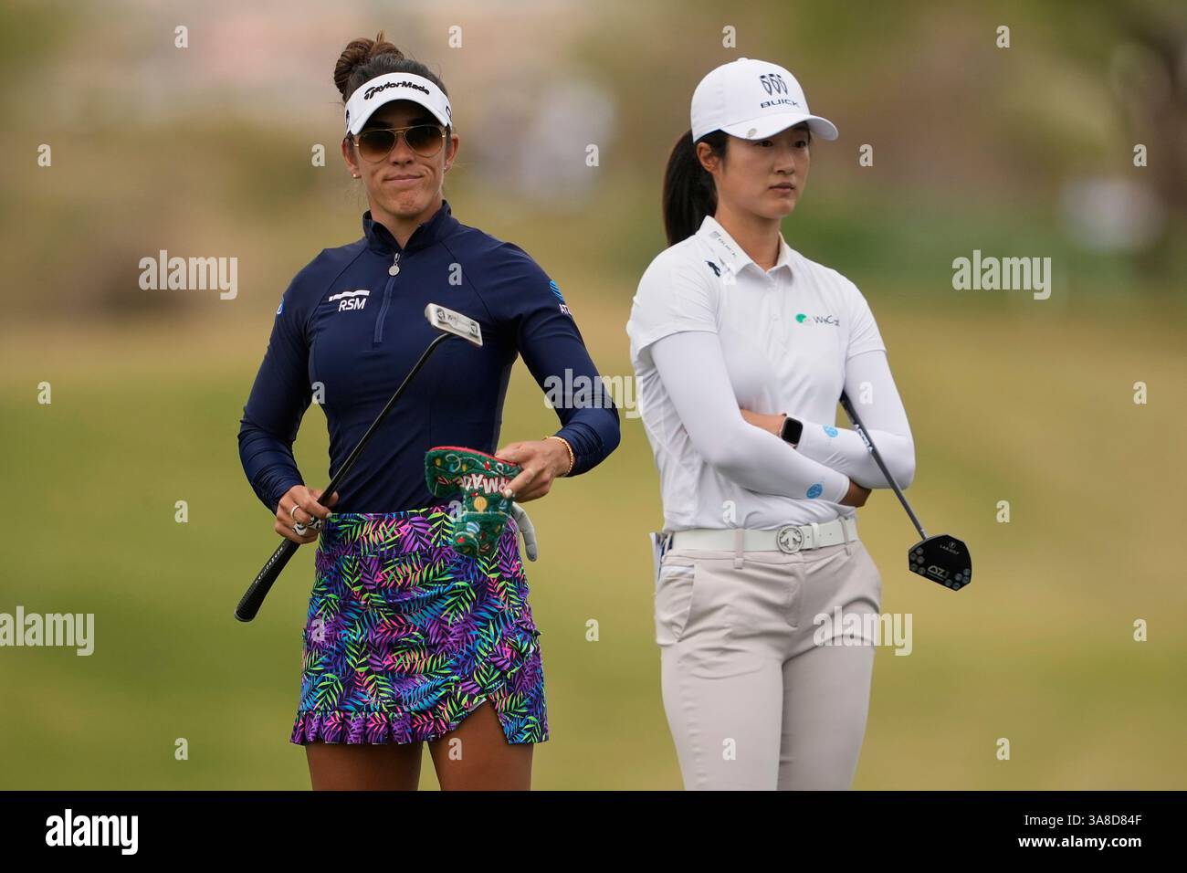 Maria Fassi, of Mexico, left, and Yu Liu, of China, watch play on the ...
